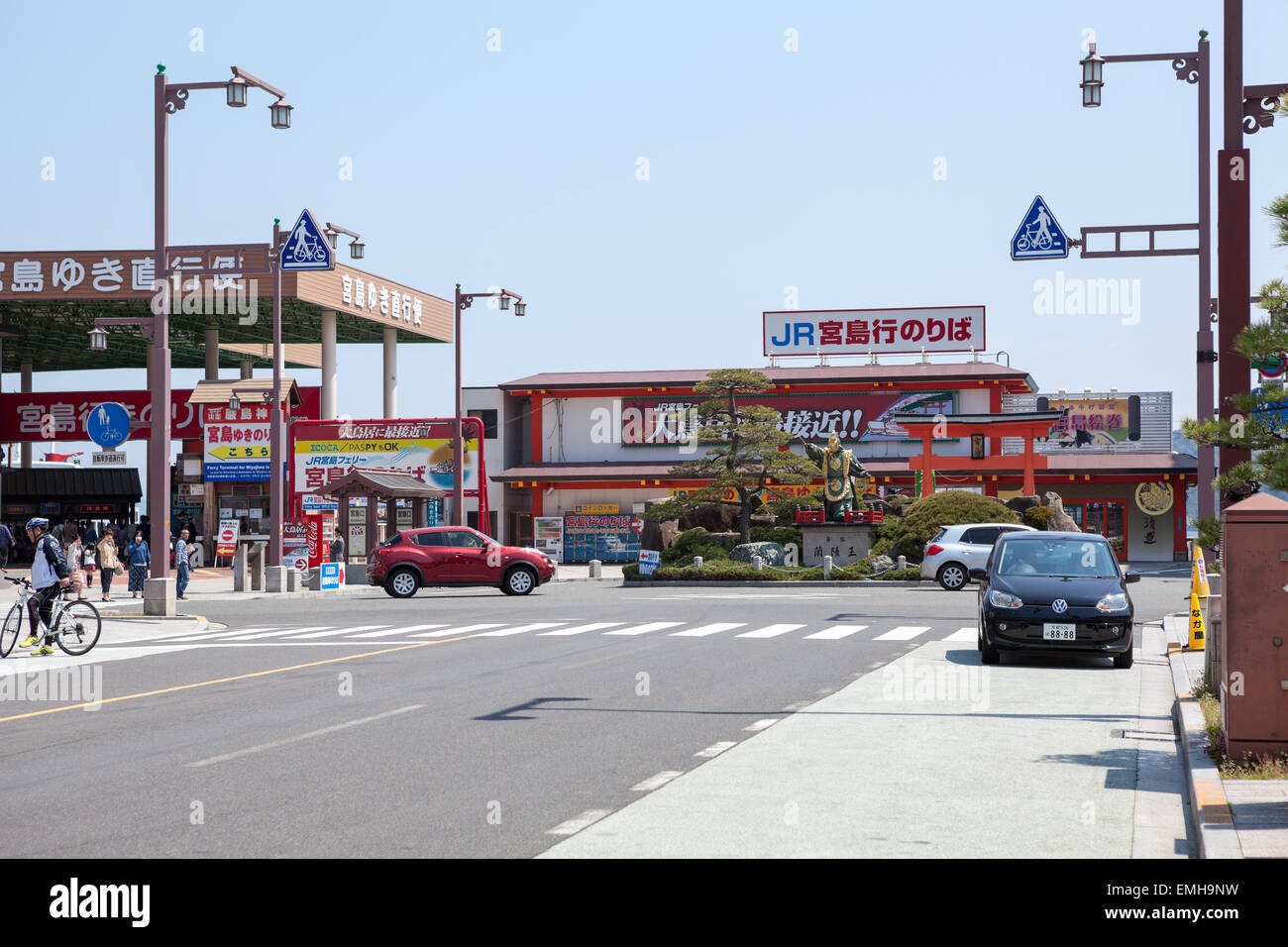 MIYAJIMAGUCHI, JAPAN - CIRCA APR, 2013: Streets and square with sea ...