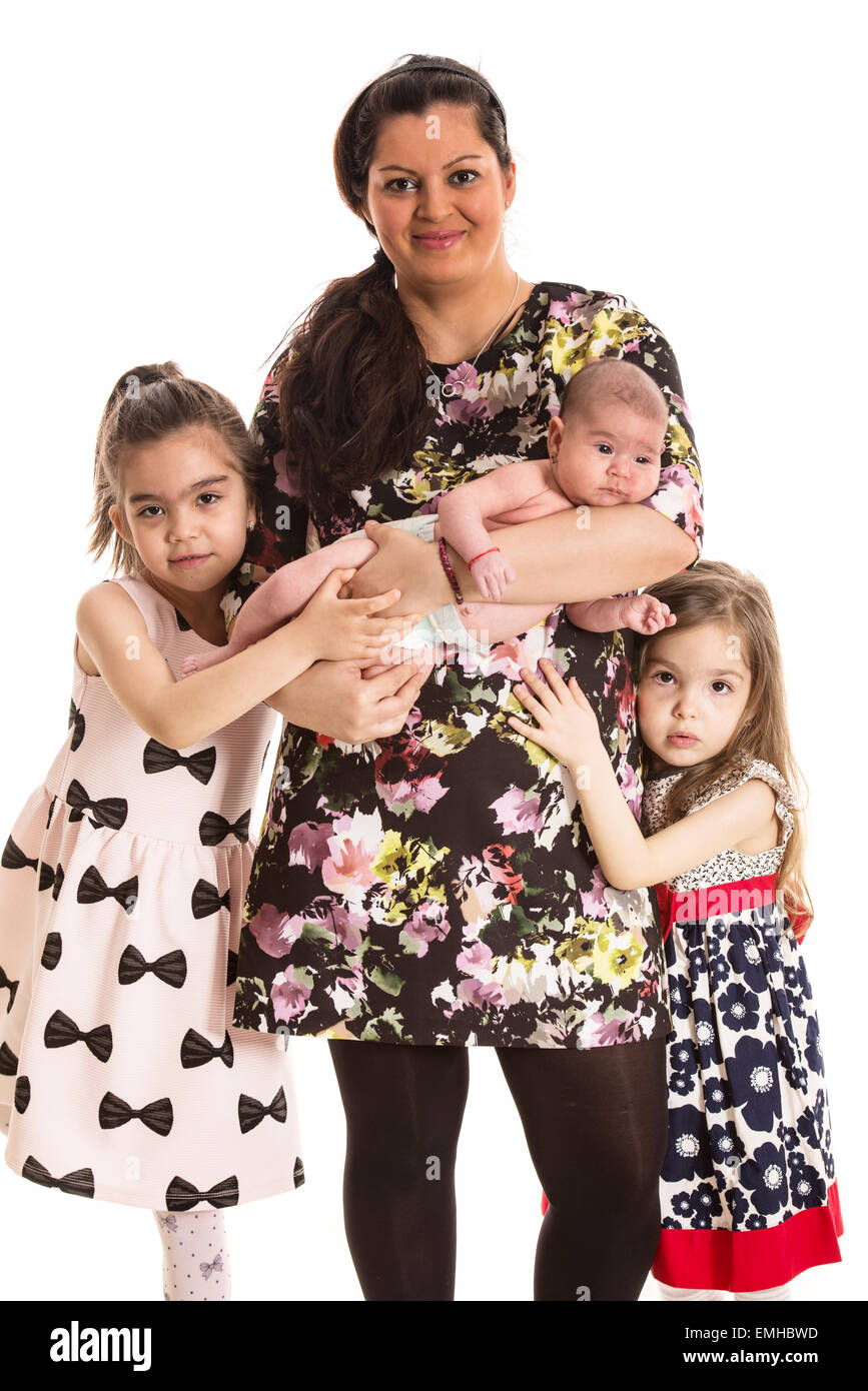Cheerful mother with three girls isolated on white background Stock ...