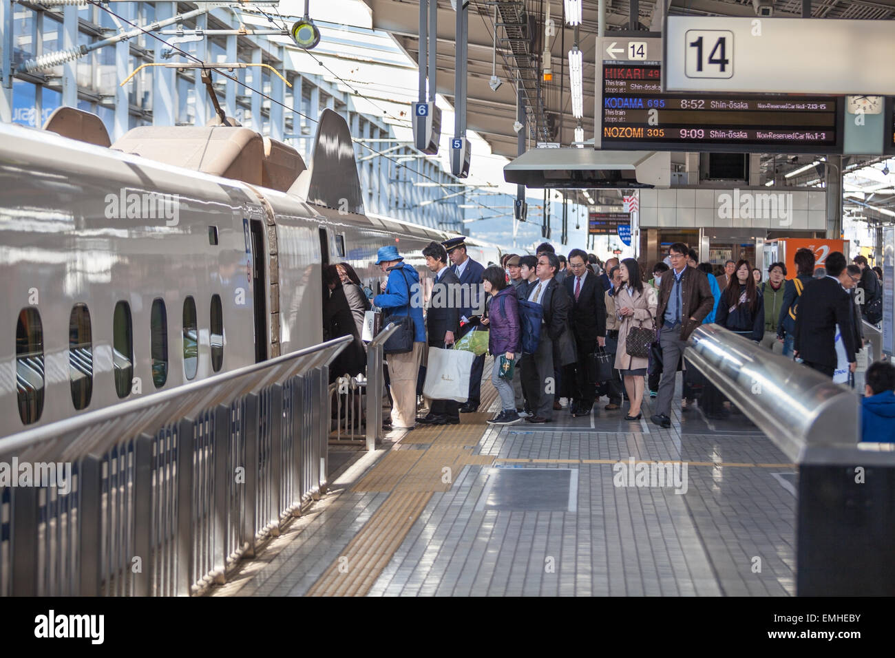 Queue for boarding the train-bullet (Shinkansen) to the Kyoto city is ...