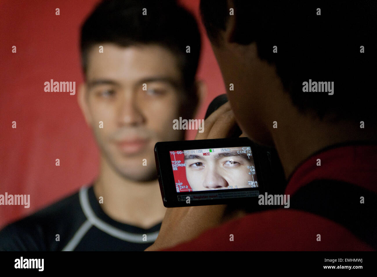 Mark 'Mugen" Striegl looks on as local media interview him during his ...