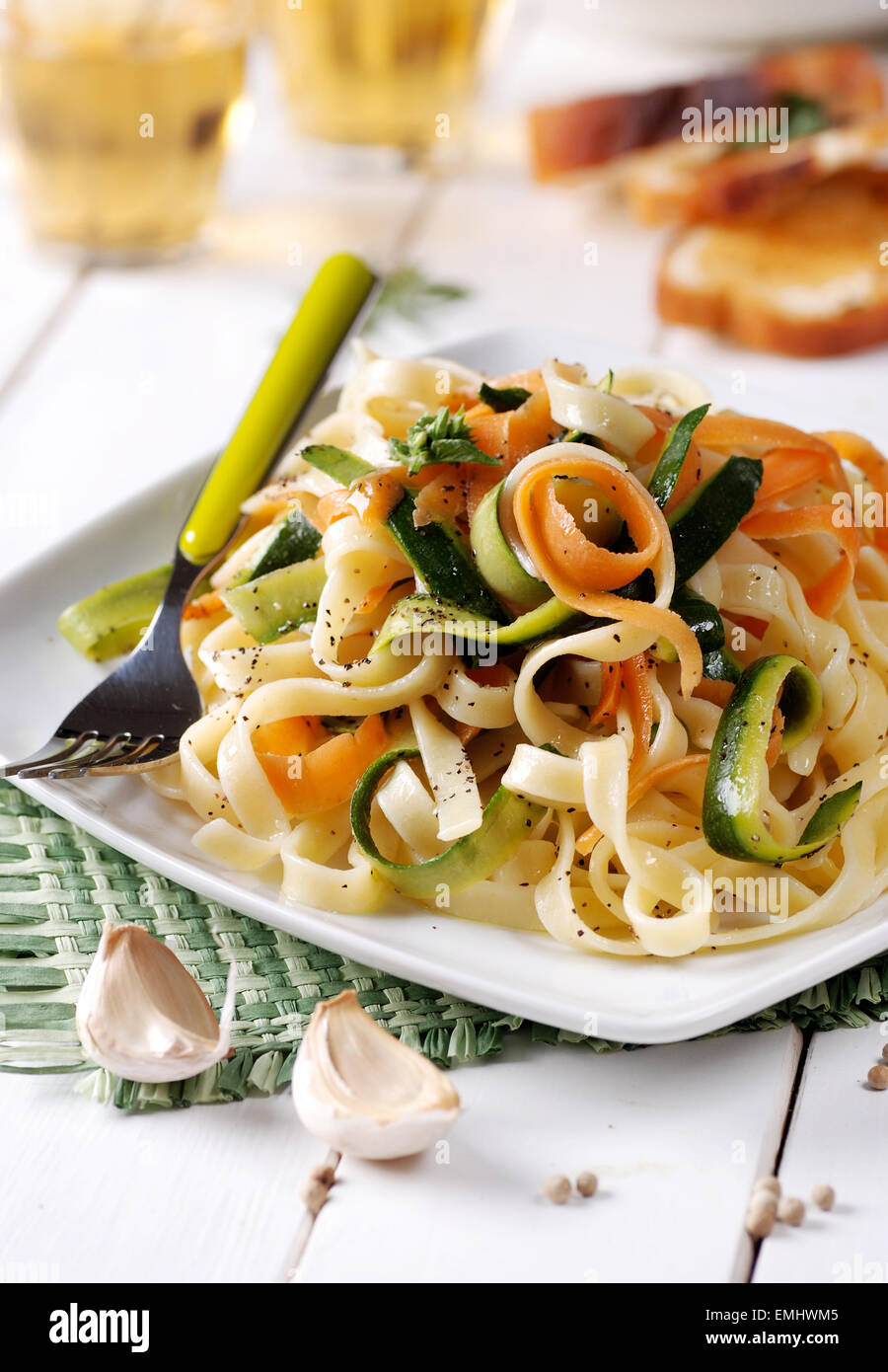 Italian pasta noodles with assorted vegetables in square dish Stock ...