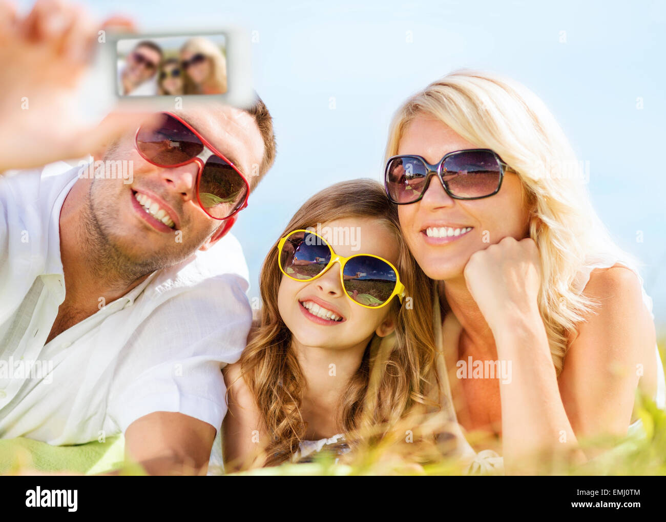 happy family with camera taking picture Stock Photo - Alamy