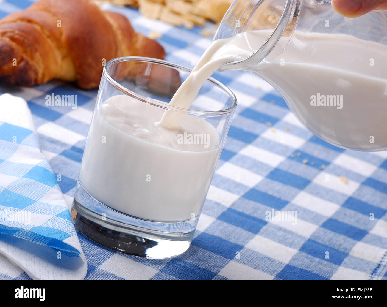 pour the fresh milk in the glass beaker Stock Photo - Alamy
