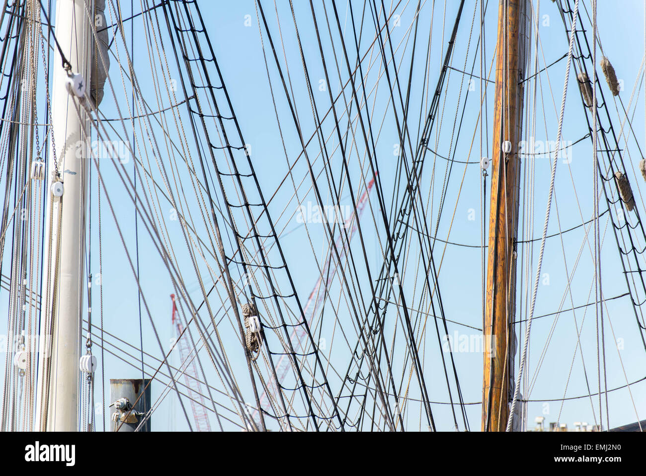 masts, rigging and rolled up sails of a tall sailboat Stock Photo - Alamy