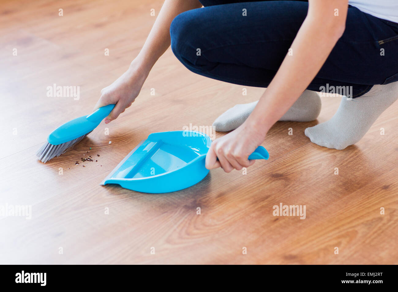 Woman sweeping floor hi-res stock photography and images - Alamy