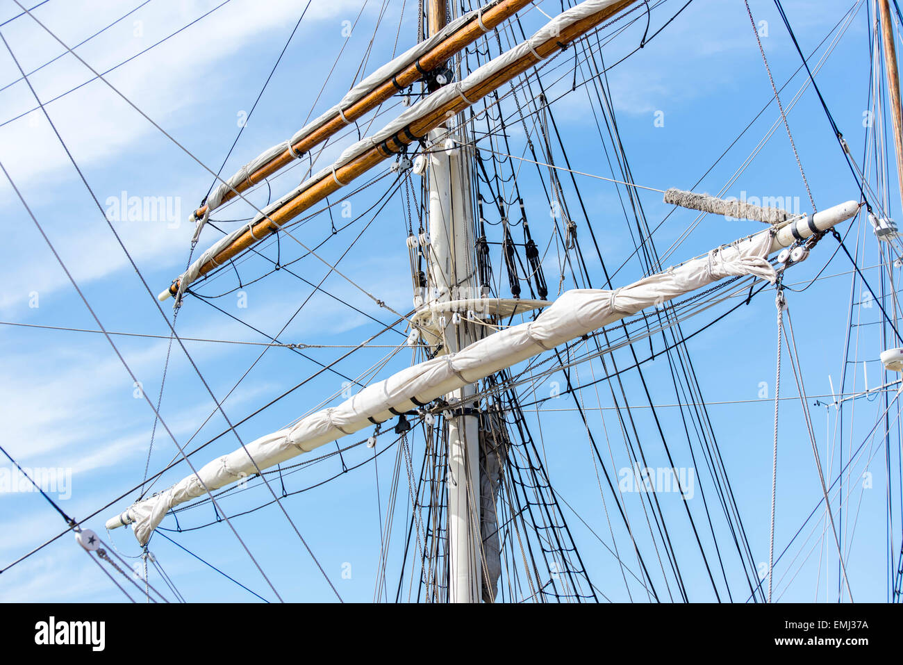 masts, rigging and rolled up sails of a tall sailboat Stock Photo - Alamy