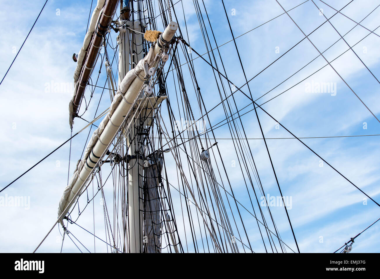 masts, rigging and rolled up sails of a tall sailboat Stock Photo - Alamy