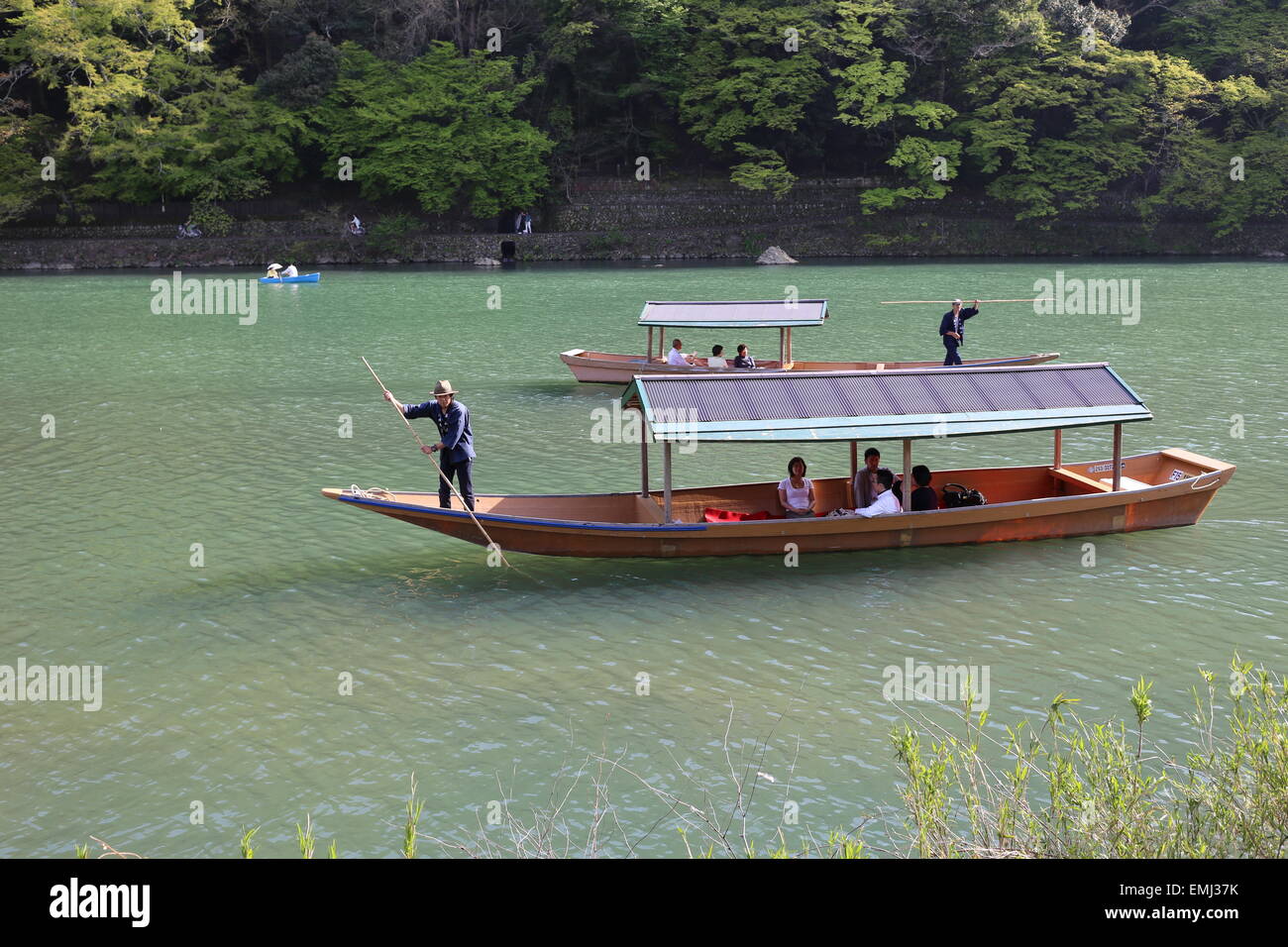 Traditional river boats in Japanese river in Kyoto, Japan Stock Photo ...