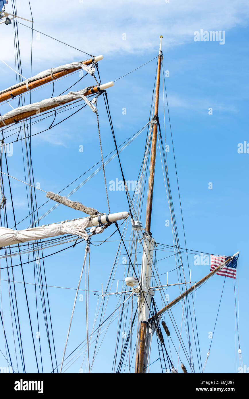 masts, rigging and rolled up sails of a tall sailboat Stock Photo - Alamy