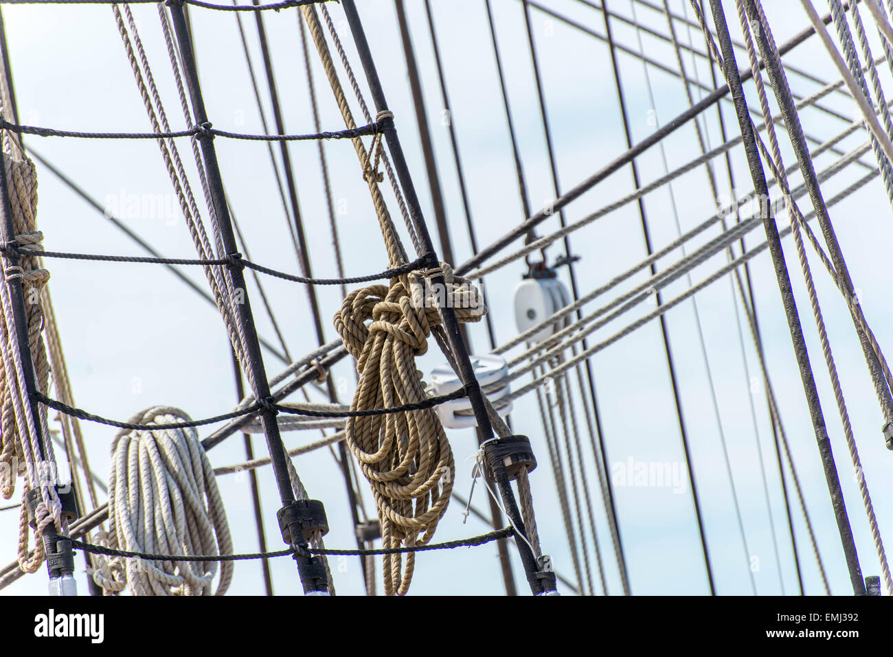 masts, rigging and rolled up sails of a tall sailboat Stock Photo - Alamy