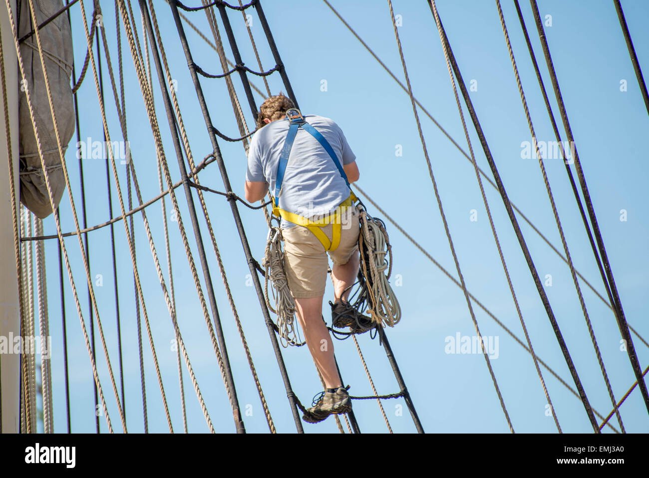 Man climbing up a ladder hi-res stock photography and images - Alamy