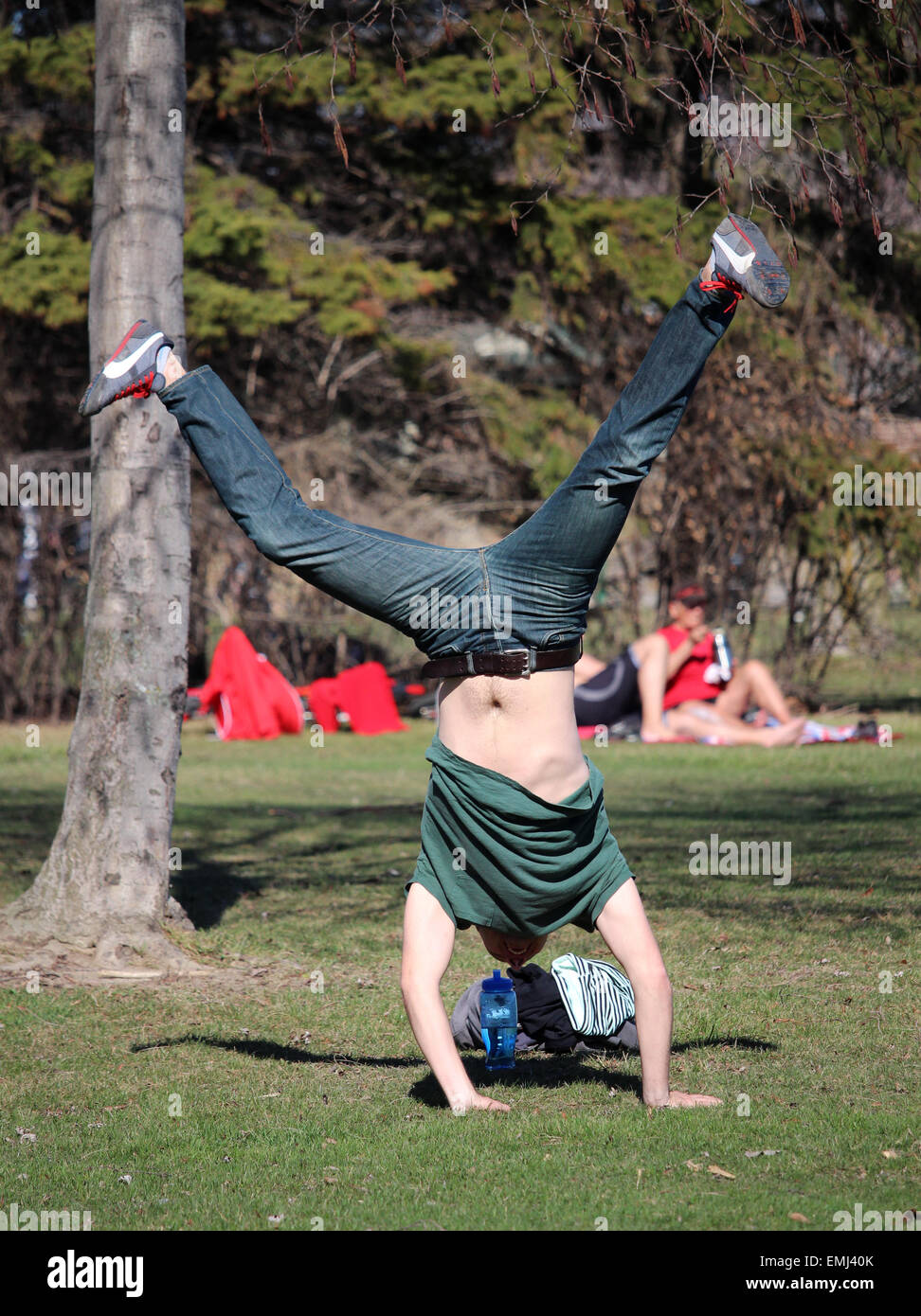 Man doing a handstand in park Stock Photo - Alamy