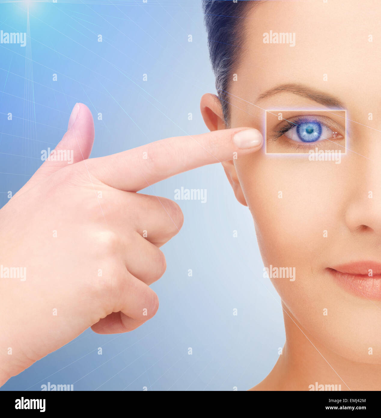 beautiful woman pointing to eye Stock Photo - Alamy