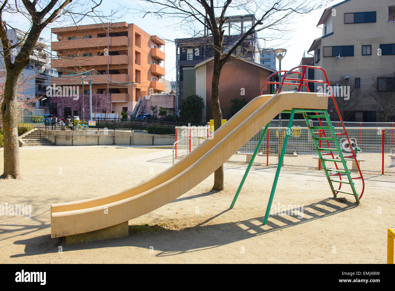 Man playground slide hi-res stock photography and images - Alamy