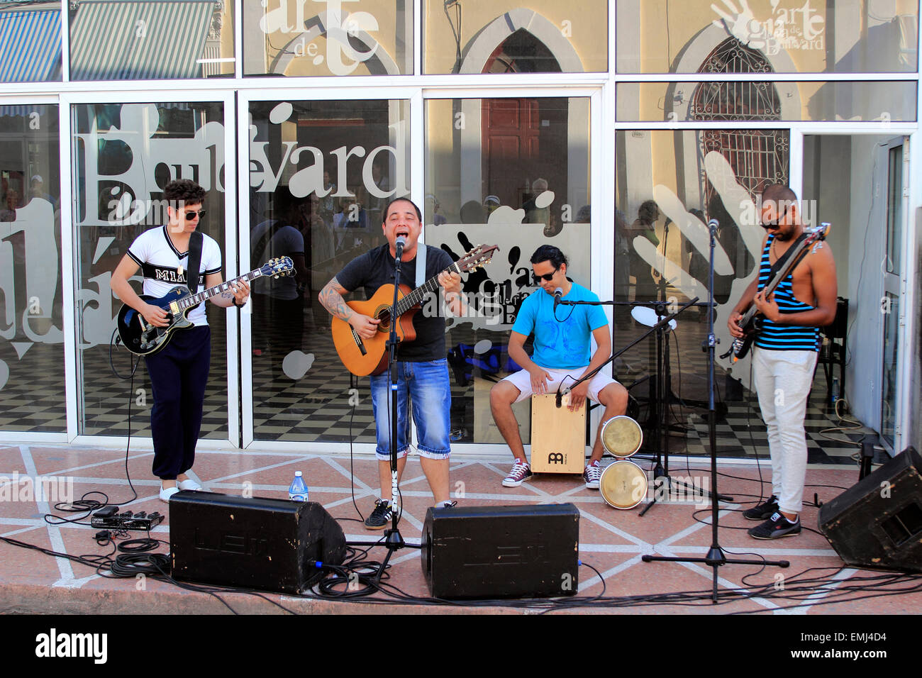 Street scene Cuban rock band playing in shopping area Cienfuegos Cuba ...