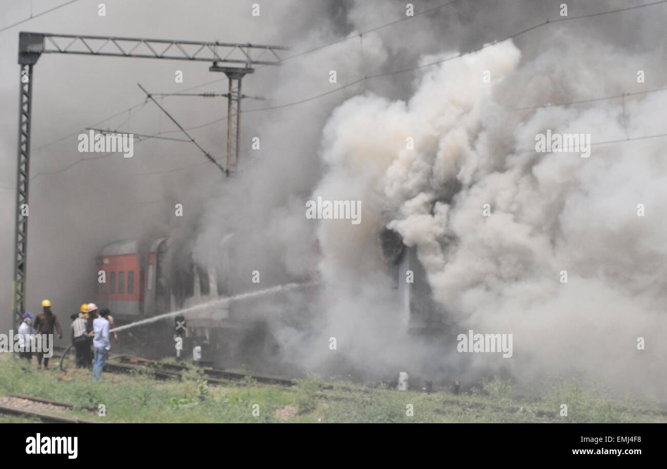 New Delhi, India. 21st Apr, 2015. An Indian firefighter sprays water to ...
