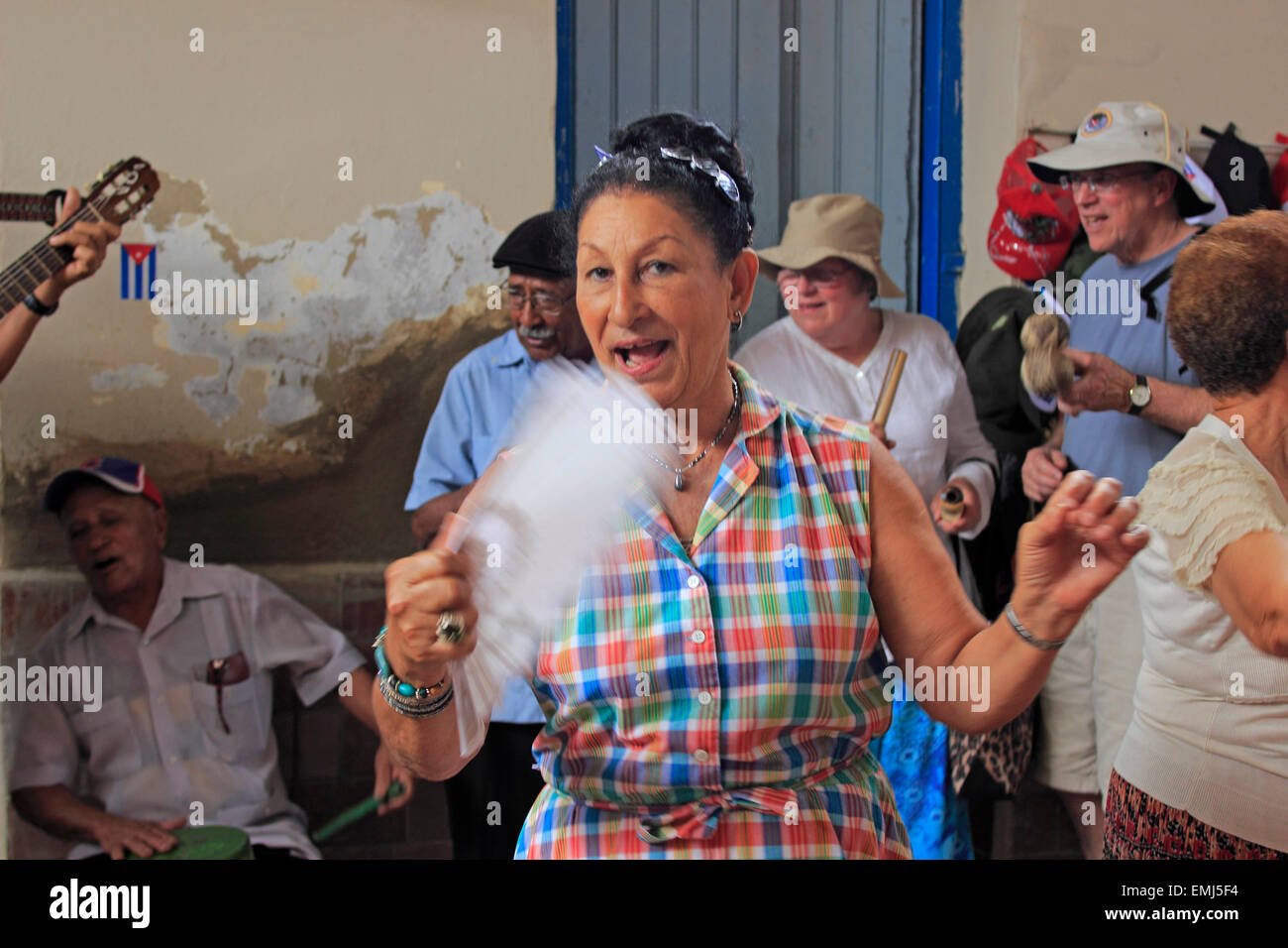 senior citizens musicians woman entertains guests at a Cuban social ...