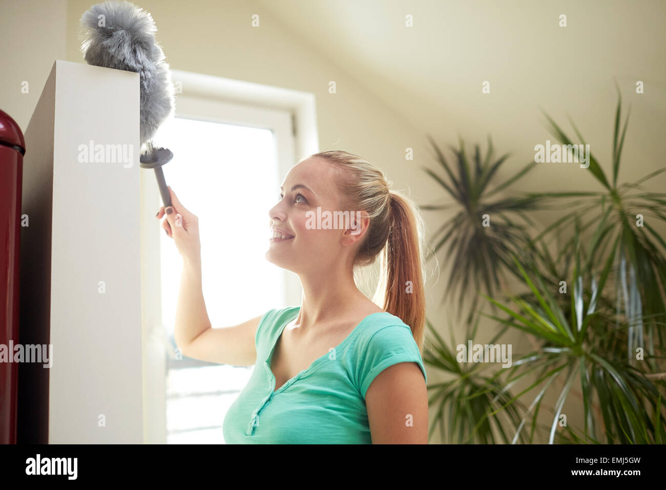 Woman and duster hi-res stock photography and images - Alamy