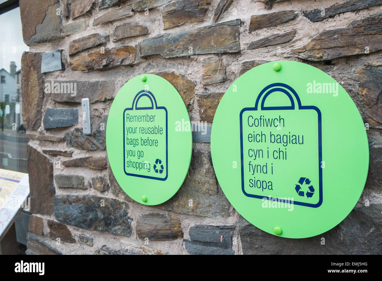 Outside Co-op store signs in English and Welsh encouraging customers to ...
