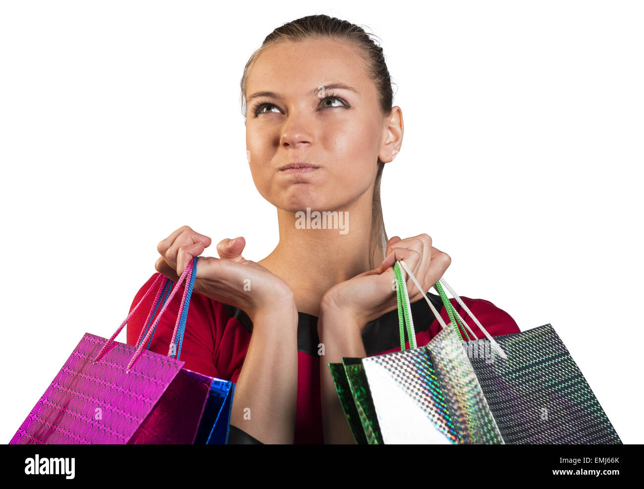 Angry lady handing bags narrowing her eyes Stock Photo - Alamy