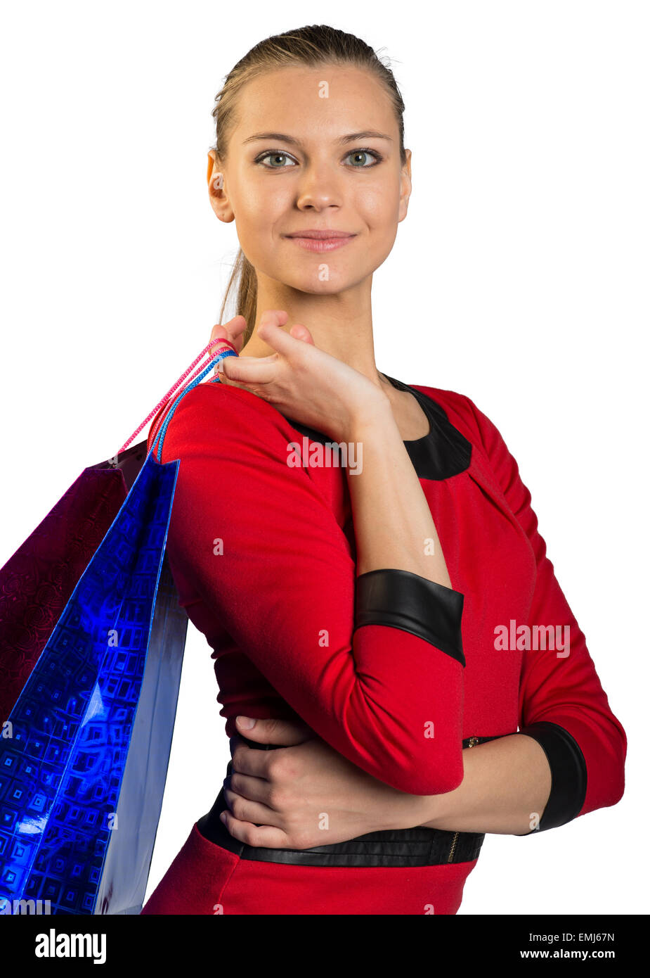 Woman with smile handing bags and hand on waist Stock Photo - Alamy