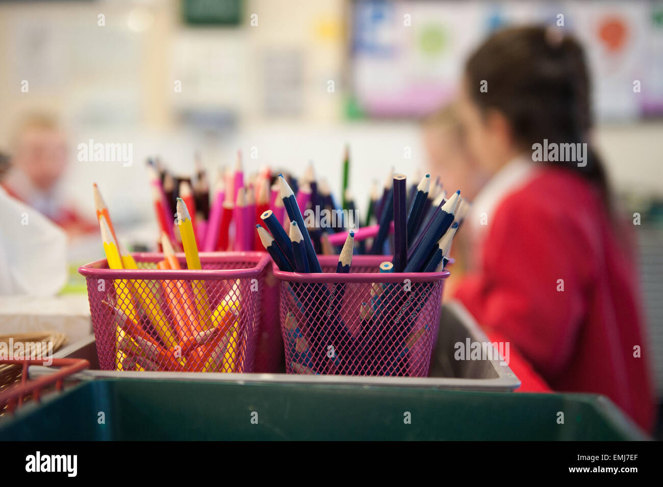 A typical UK primary school classroom with coloured pencils in the ...
