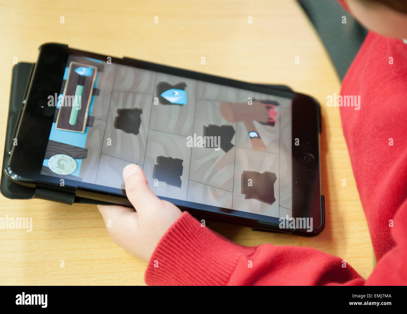 A UK primary school pupil using an ipad in a lesson in class Stock ...