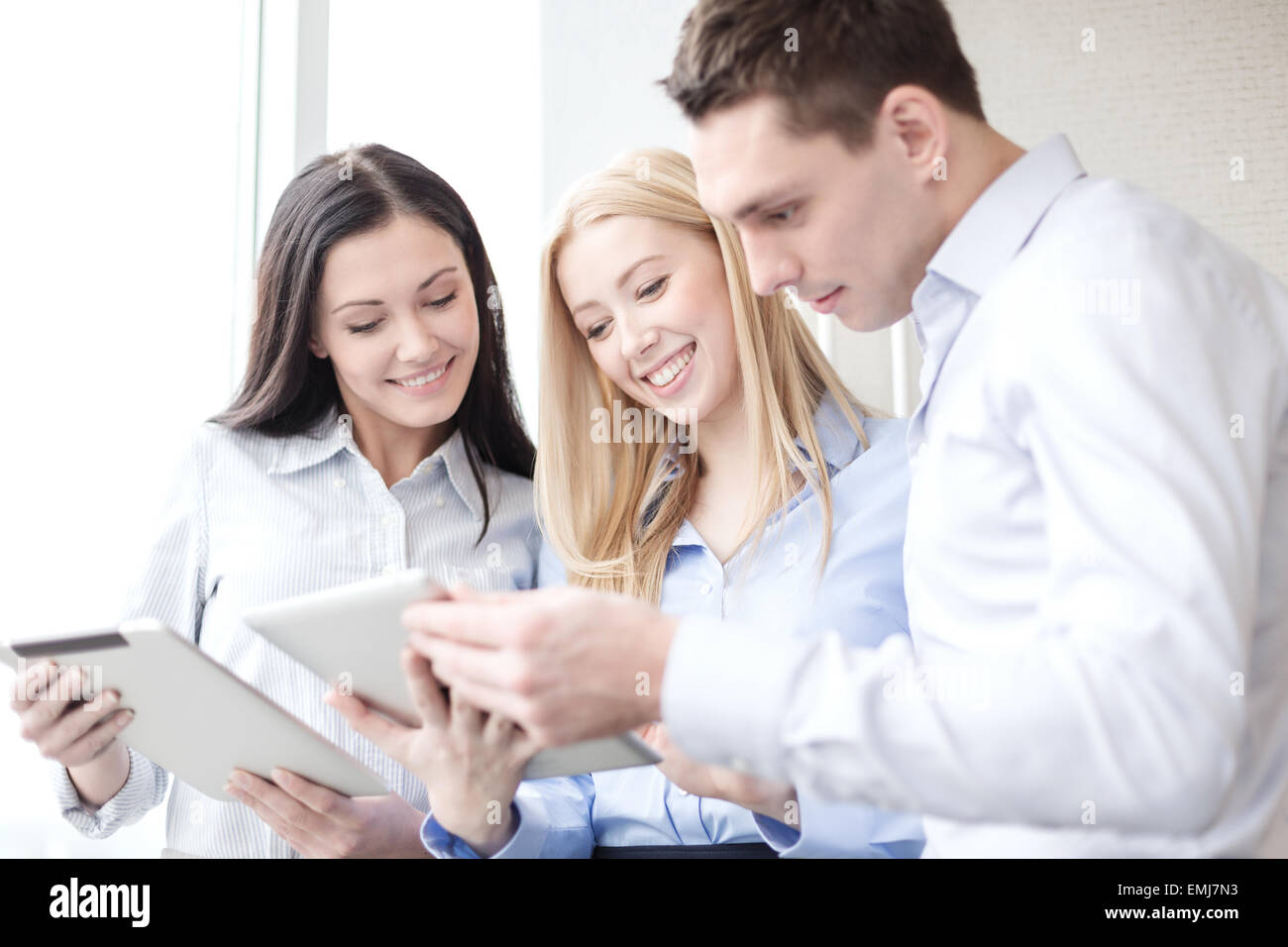 business team working with tablet pcs in office Stock Photo - Alamy