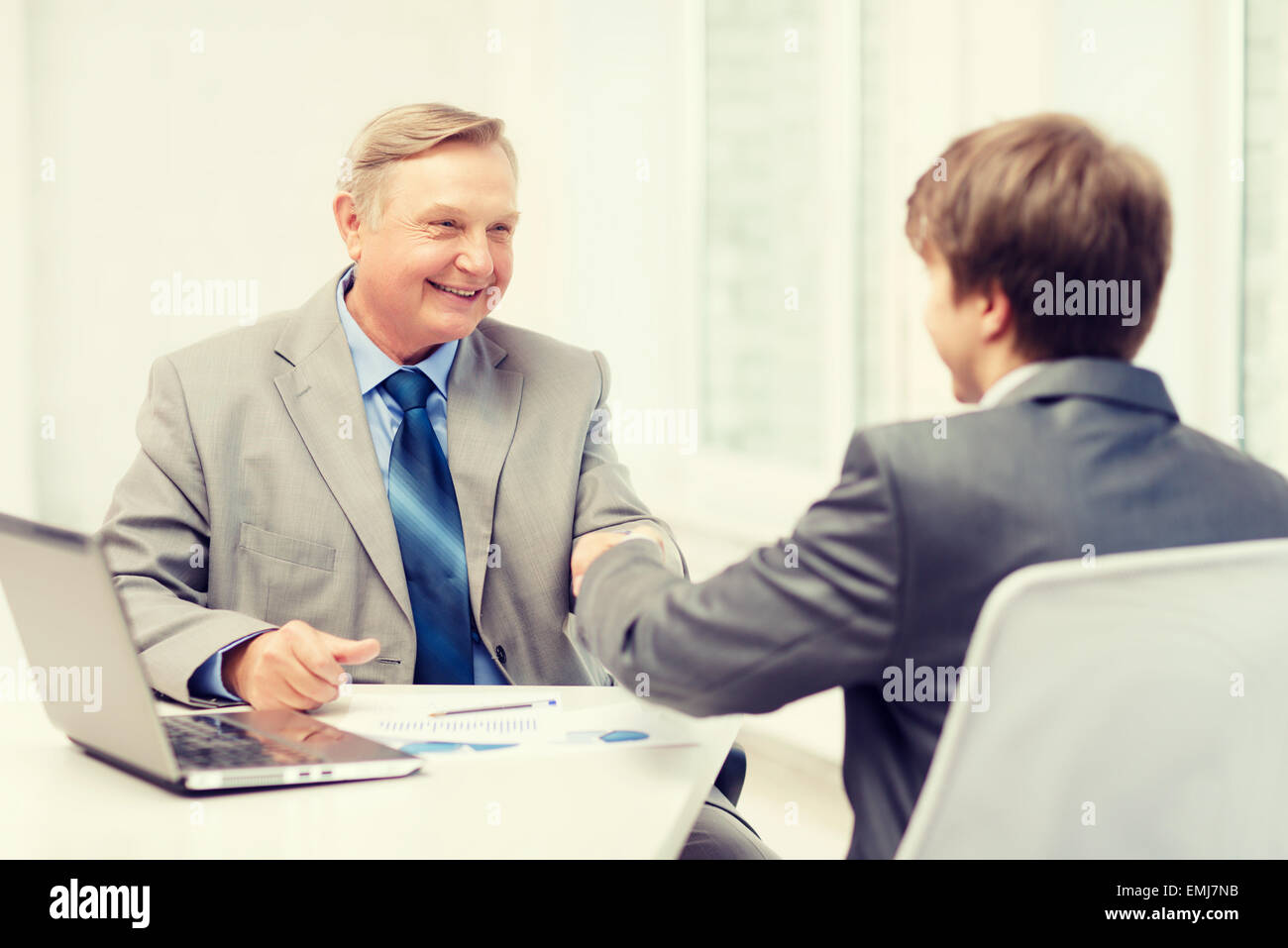 Older men shaking hands hi-res stock photography and images - Alamy