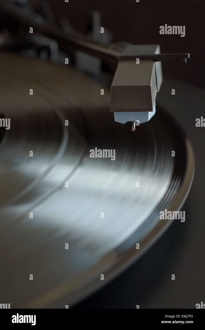Vinyl Record and record player stylus low key light and selective focus ...