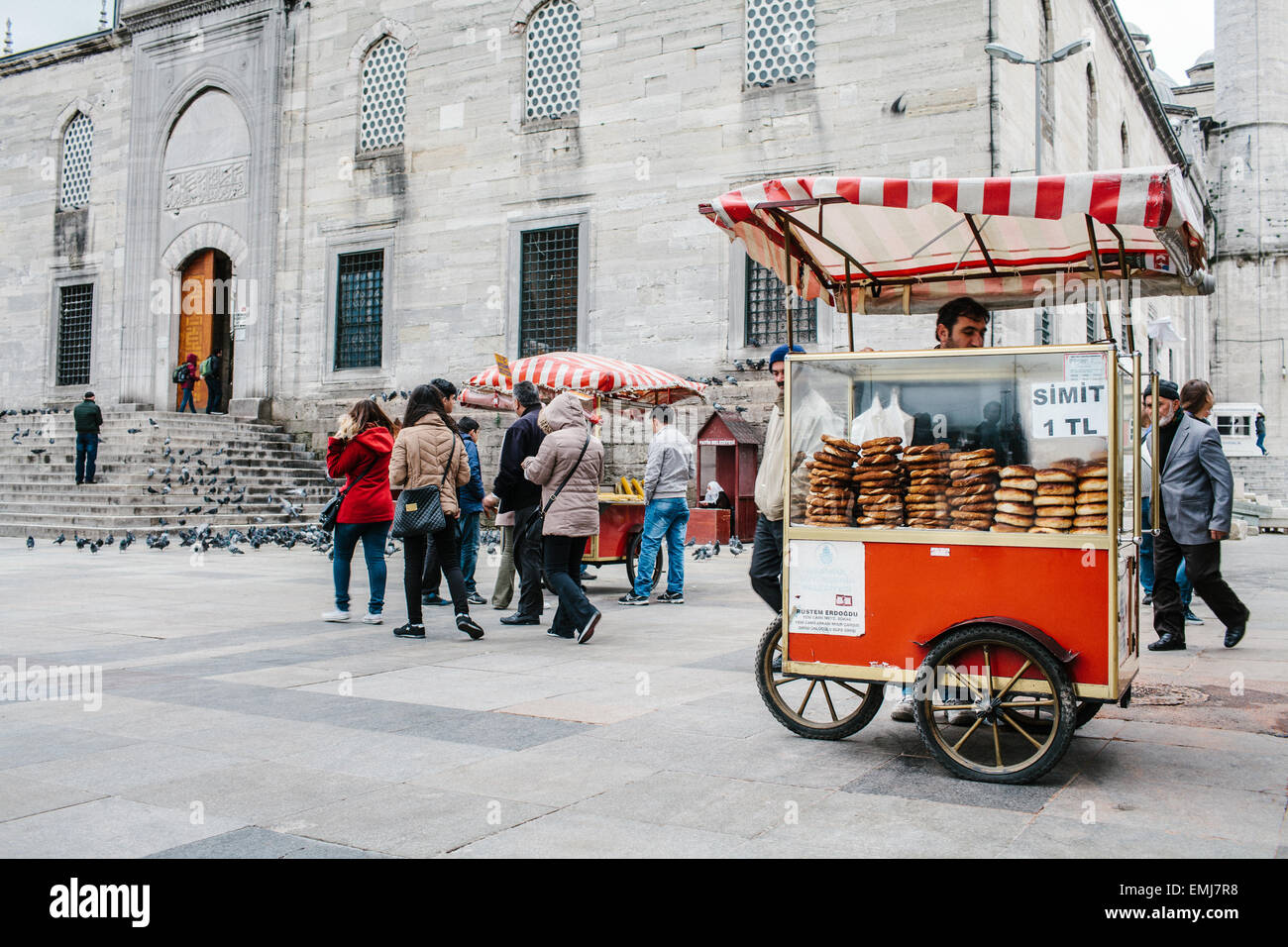 A Simit seller outside Yeni Camii, the mosque adjacent to Eminonu ...