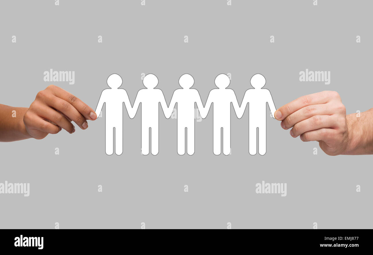 hands holding paper chain people Stock Photo - Alamy