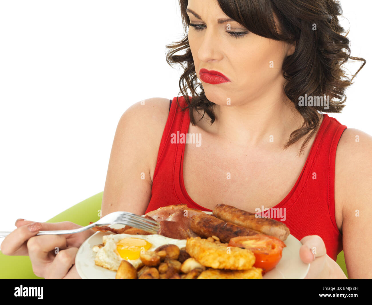 Young Confident Woman With Dark Hair Eating A Traditional Fried Full ...