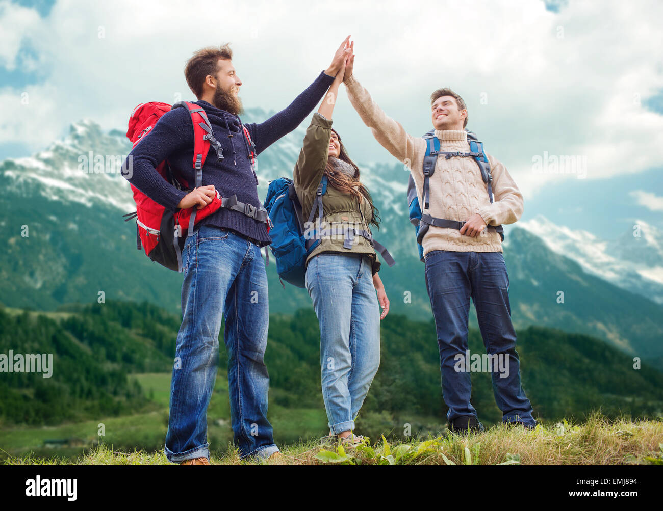 group of smiling friends with backpacks hiking Stock Photo - Alamy