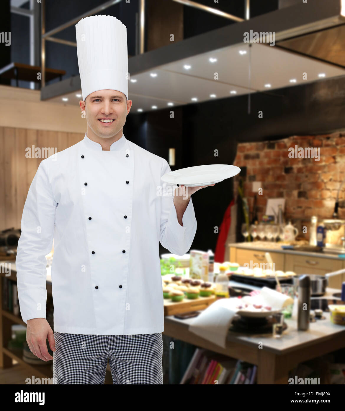 happy male chef cook showing empty plate Stock Photo - Alamy