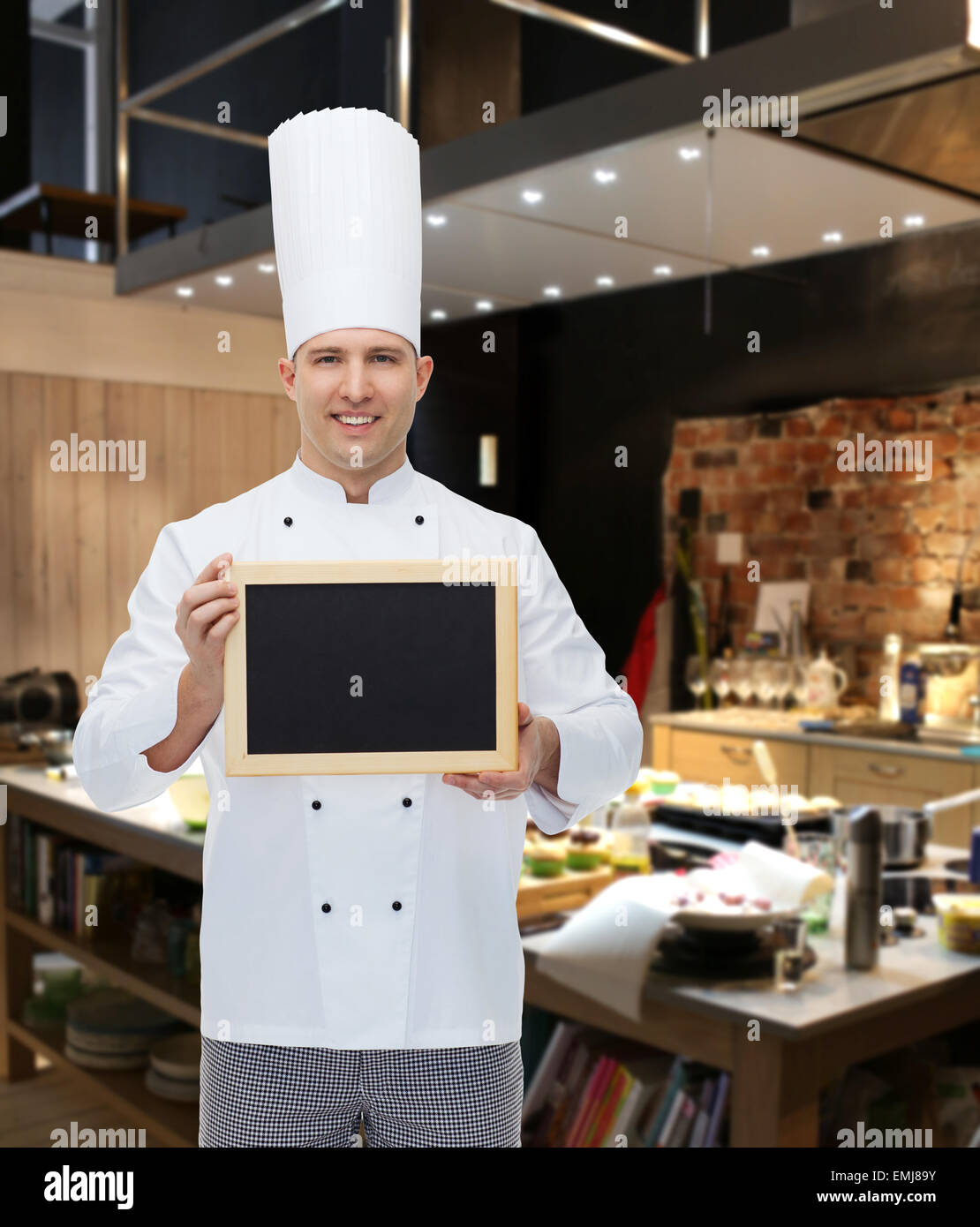 happy male chef cook holding blank menu board Stock Photo - Alamy