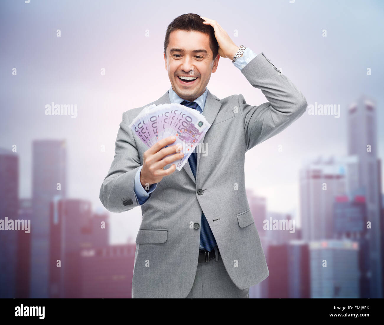 happy laughing businessman with euro money Stock Photo - Alamy
