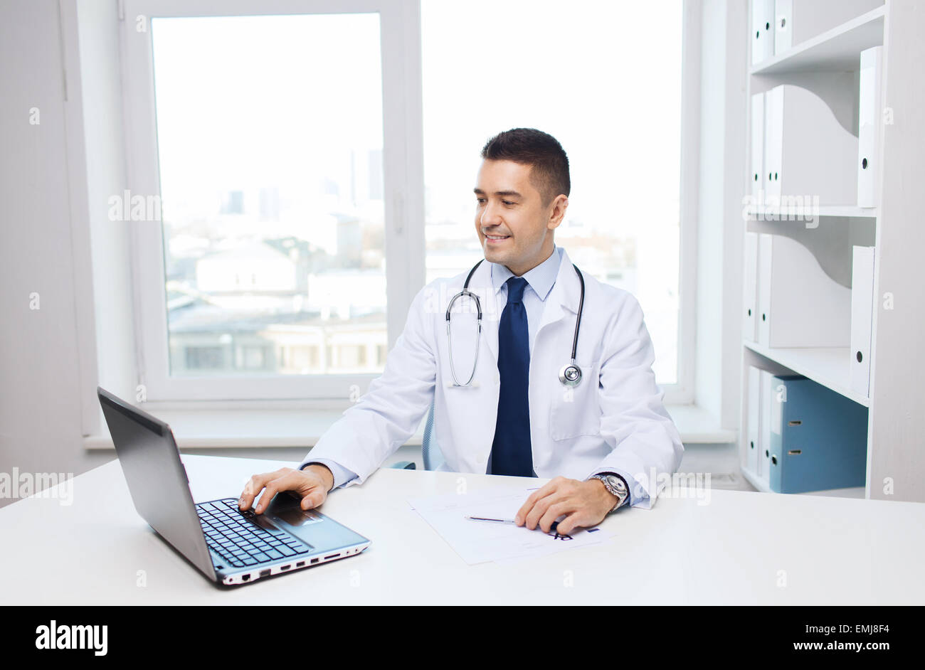 Doctor typing in office hi-res stock photography and images - Alamy