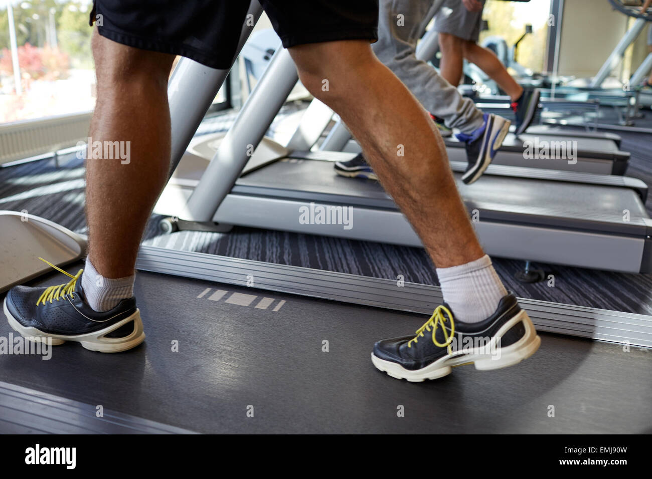 close up of men legs walking on treadmills in gym Stock Photo - Alamy