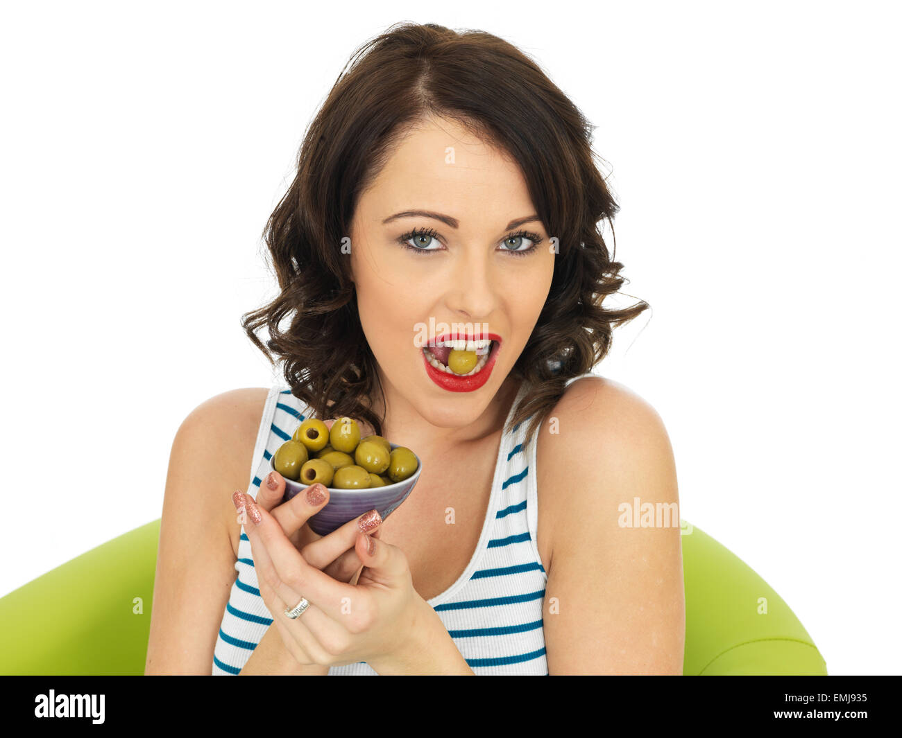 Young Healthy Woman Eating Green Olives Stock Photo - Alamy
