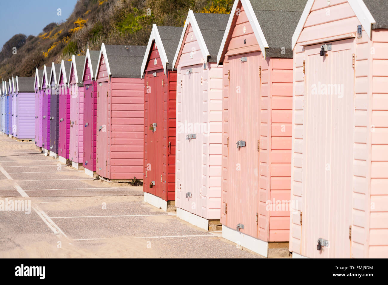 pastel coloured beach huts along the promenade between Bournemouth and ...