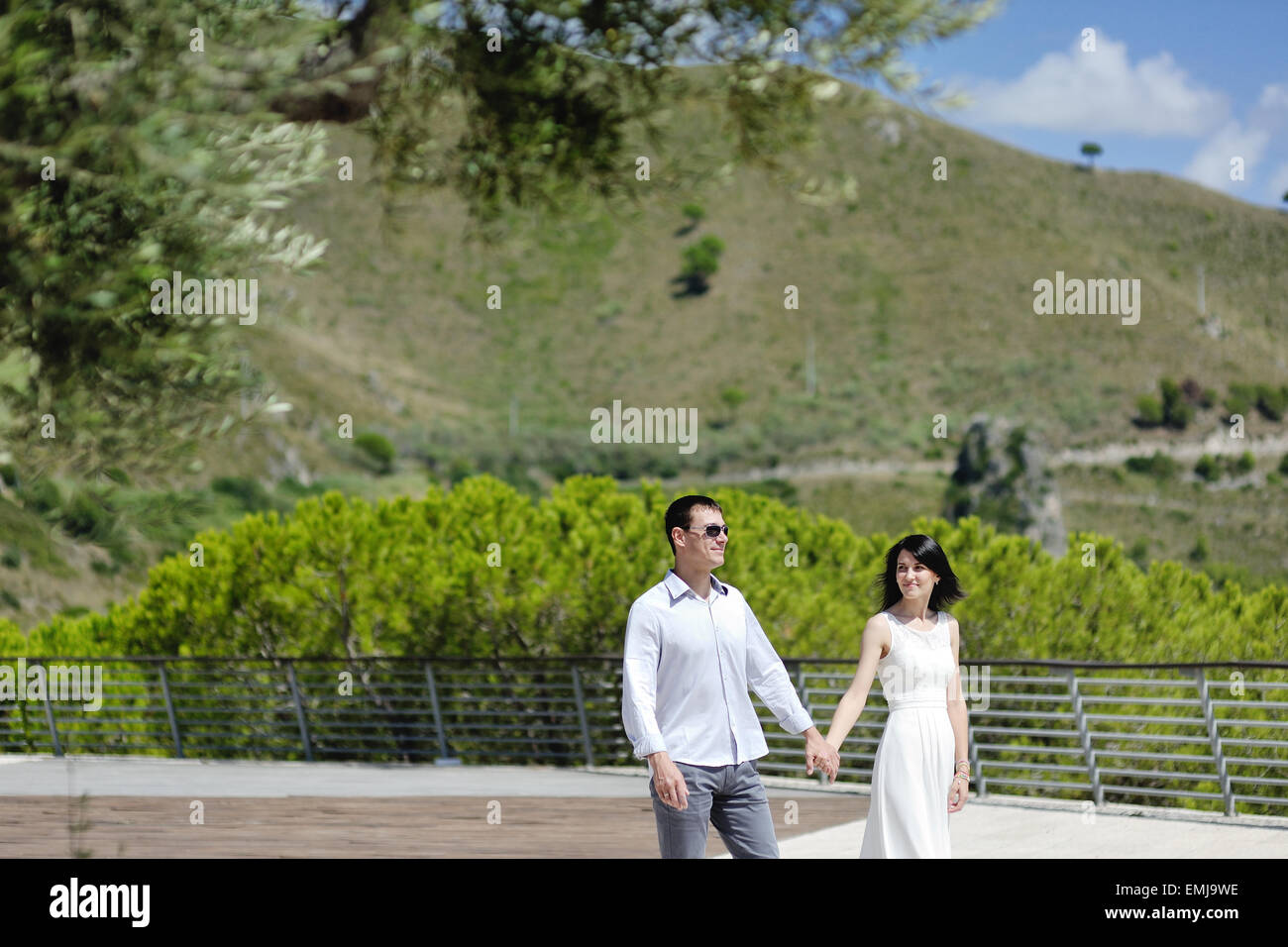 beautiful couple walking holding hands Stock Photo - Alamy