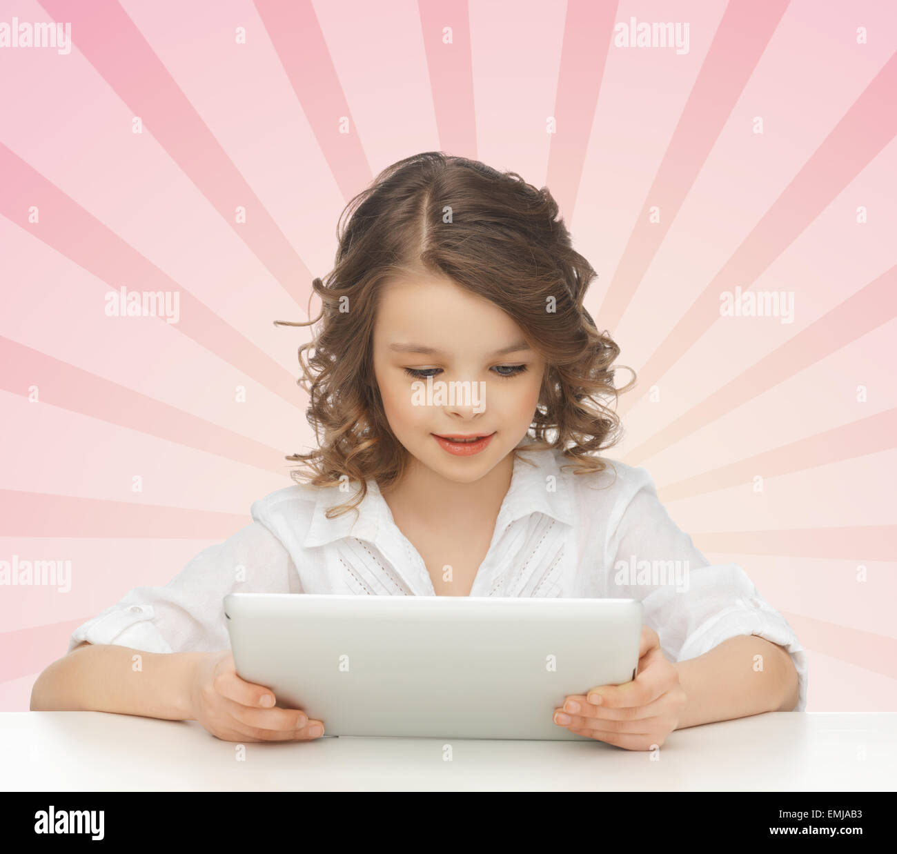 girl holding and looking to tablet pc computer Stock Photo - Alamy