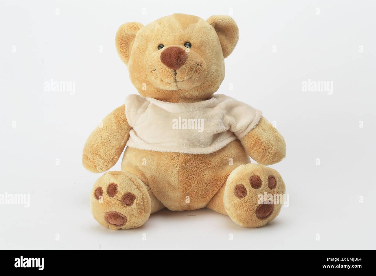 Smiling cuddly teddy bear on white background Stock Photo - Alamy