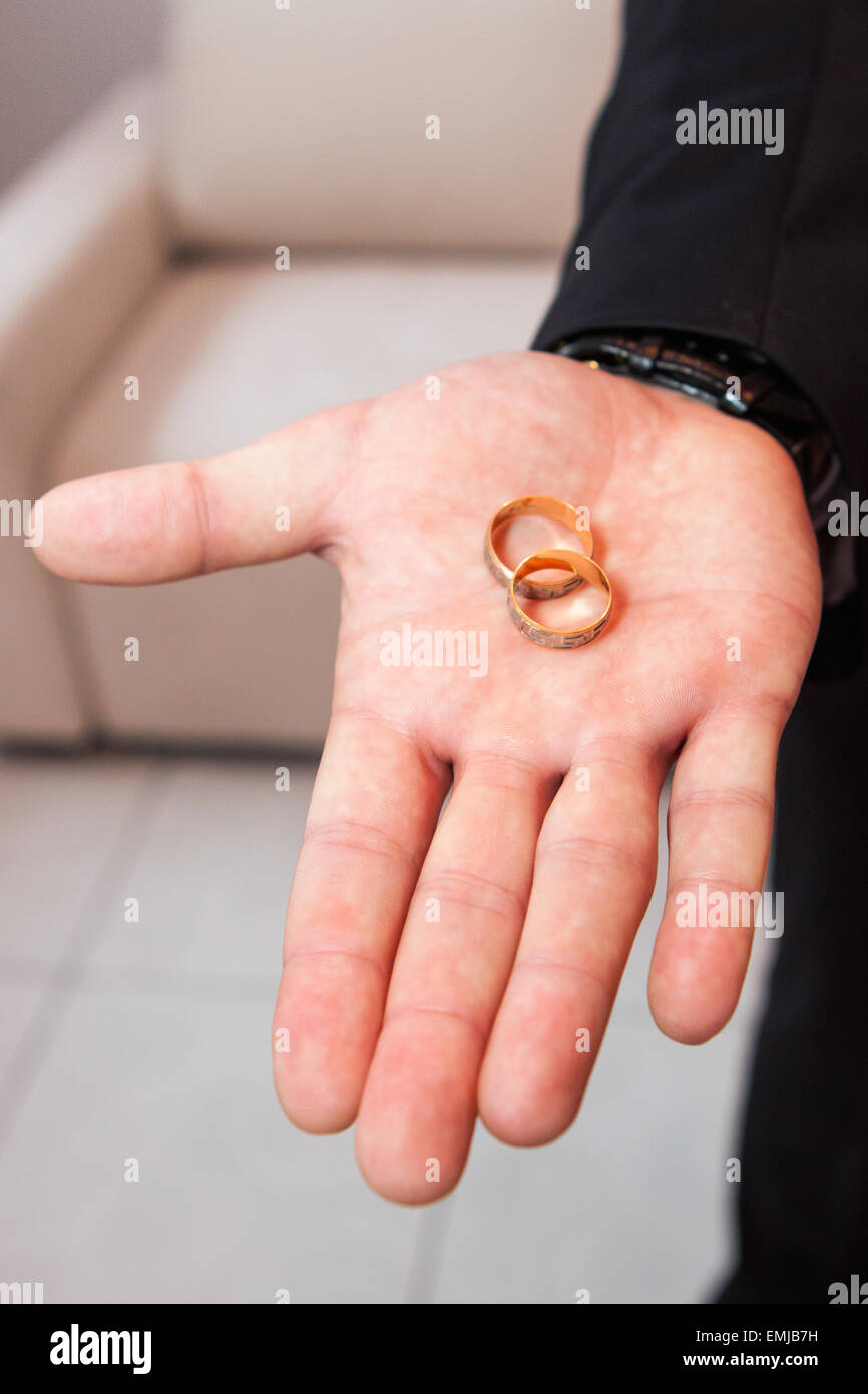 Two hands holding rings hi-res stock photography and images - Alamy