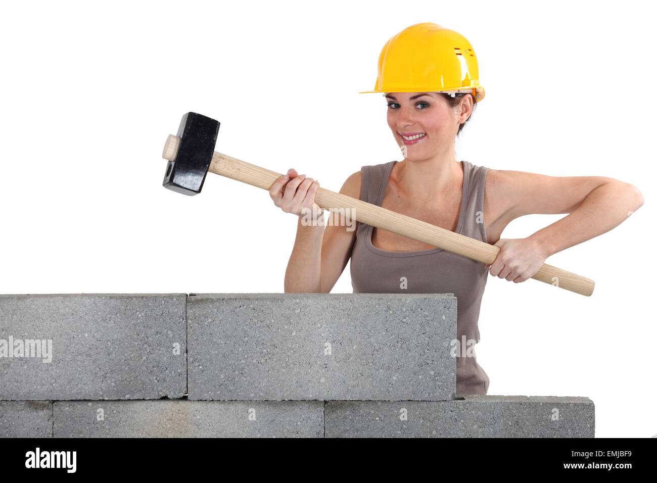 Woman with a sledge hammer Stock Photo - Alamy