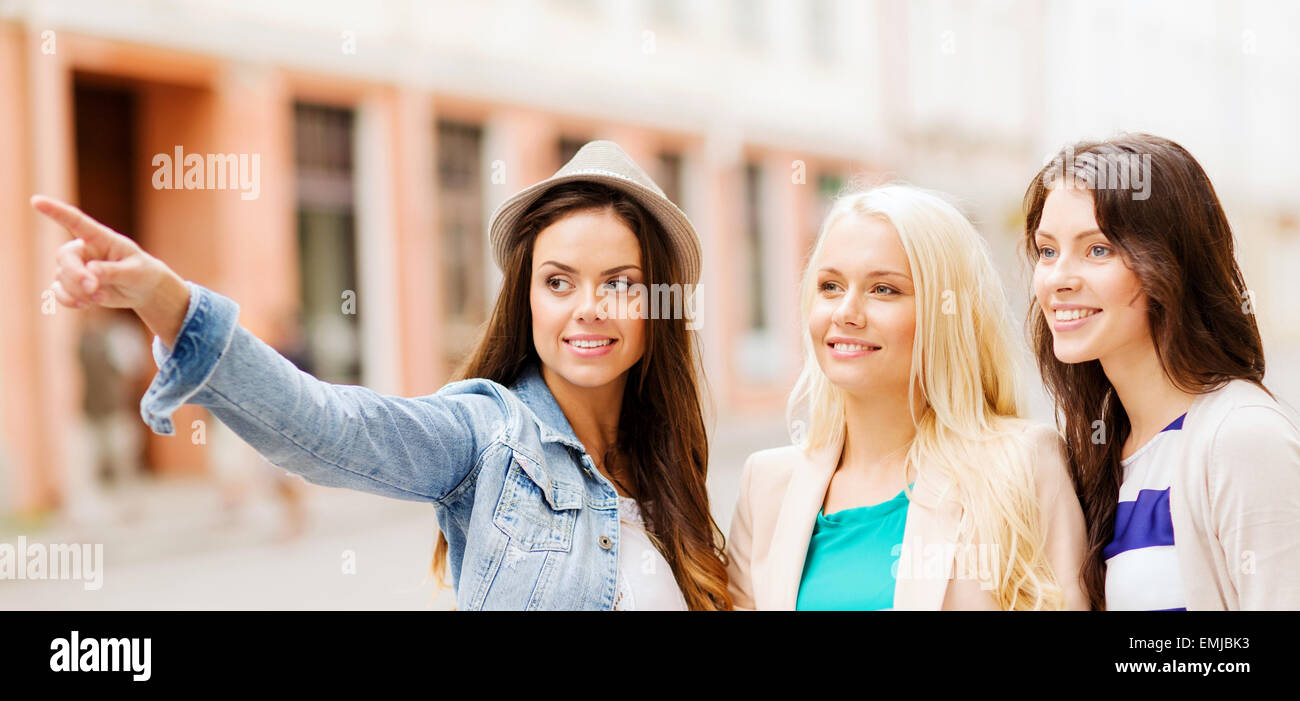 beautiful girls looking for direction in the city Stock Photo - Alamy