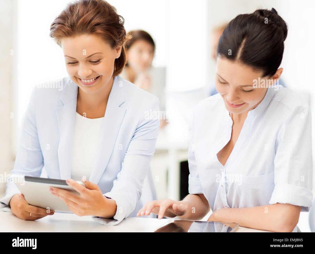 business team working with tablet pc in office Stock Photo - Alamy