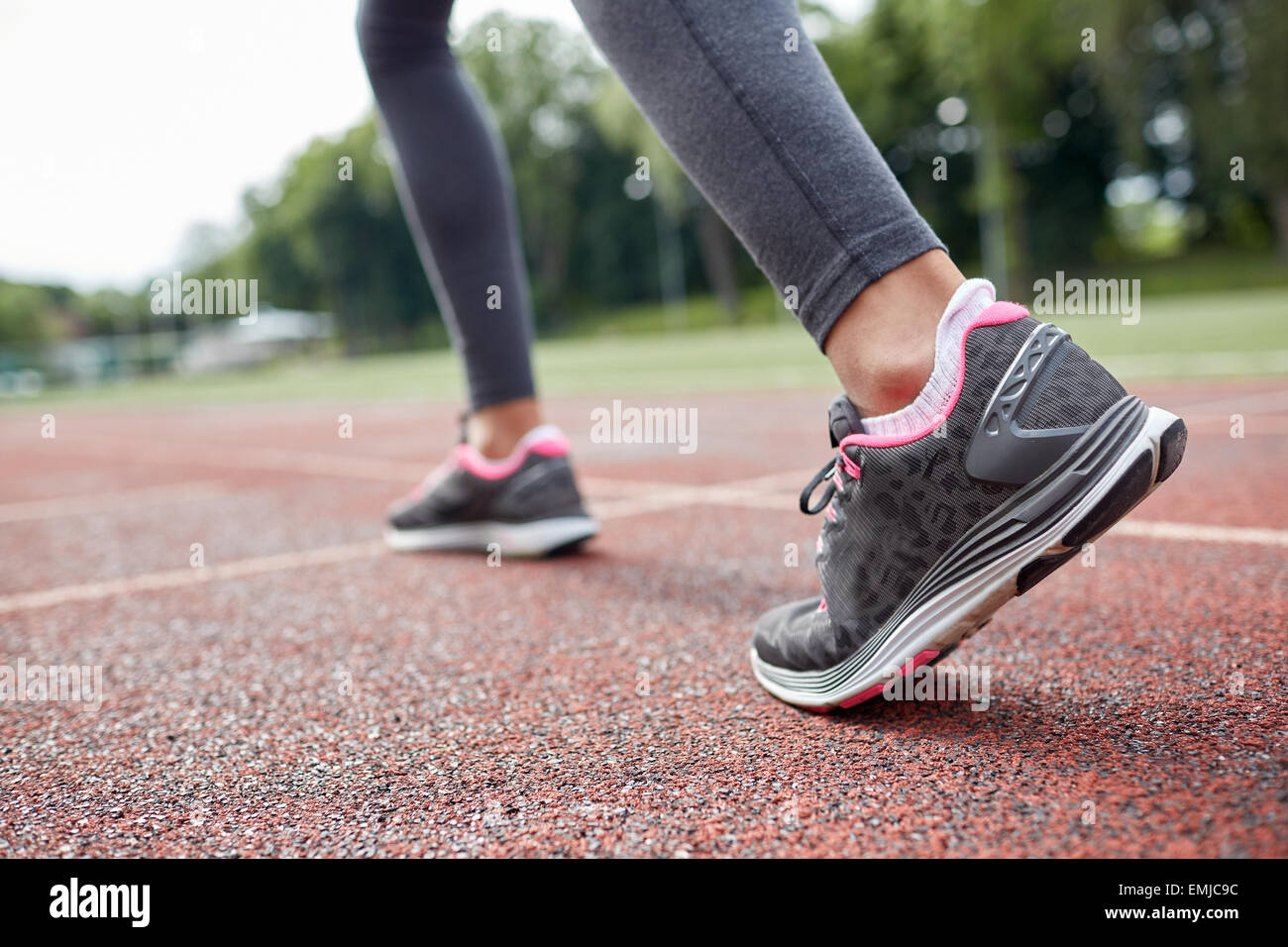 close up of woman feet running on track from back Stock Photo - Alamy