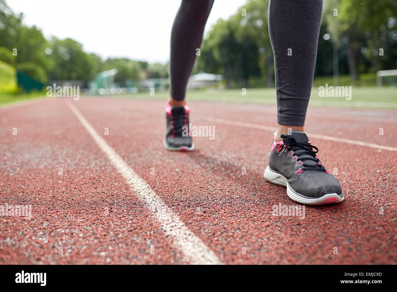 close up of woman feet running on track from back Stock Photo - Alamy